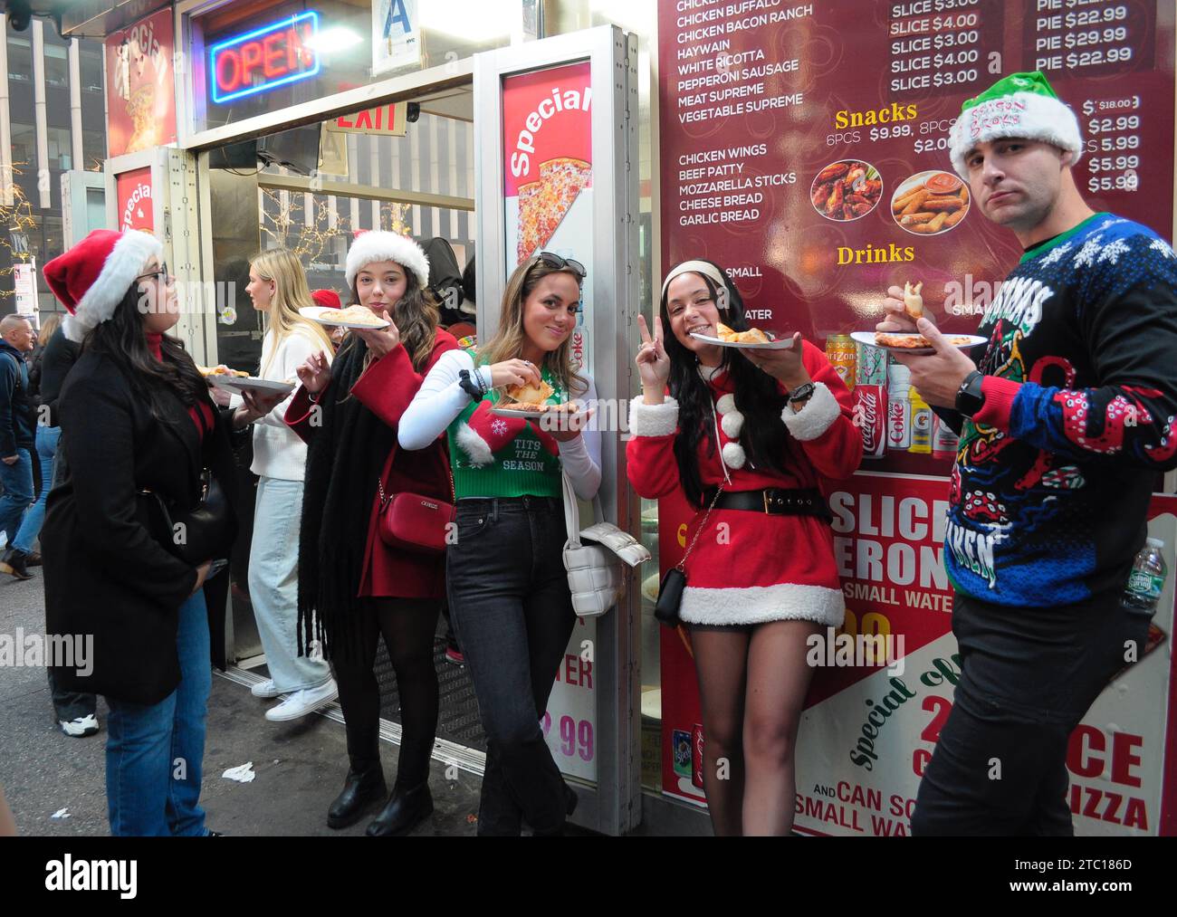 New York, United States. 09th Dec, 2023. A group of SantaCon ...