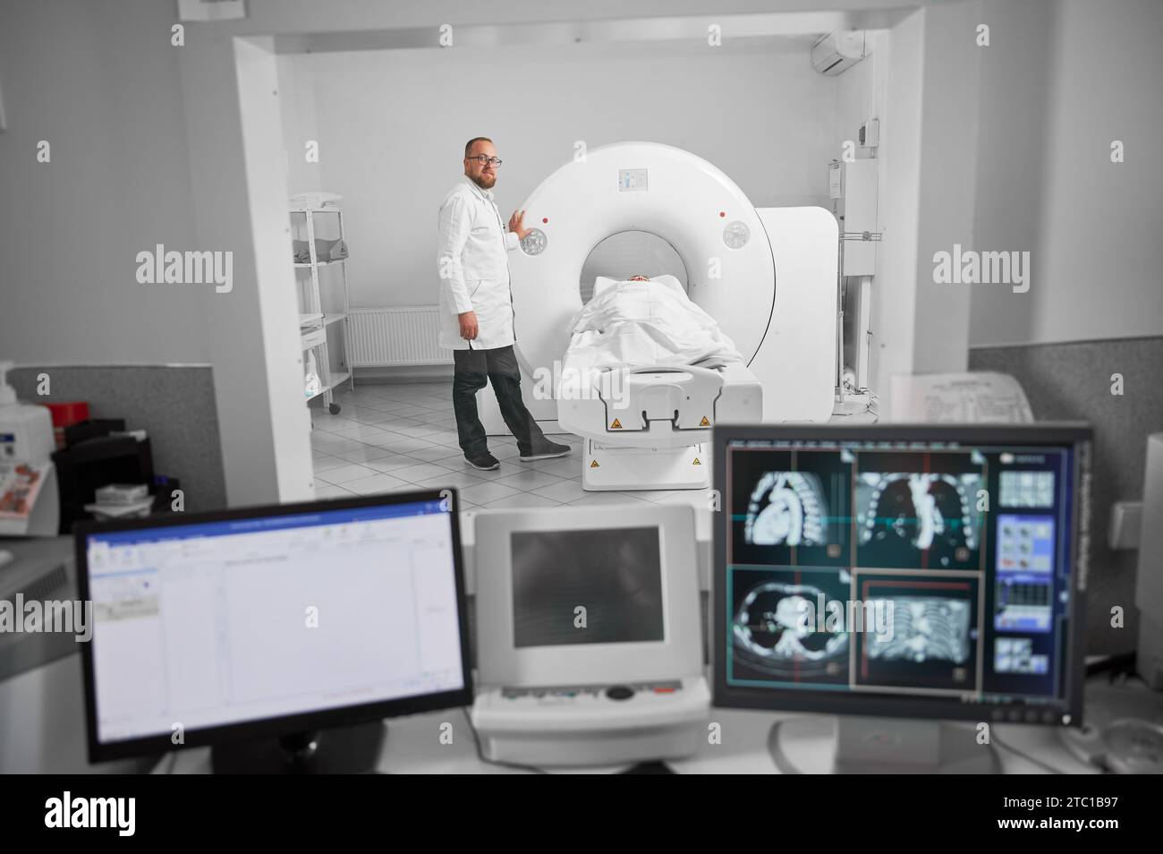 Medical computed tomography or MRI scanner. Doctor making MRI, patient ...