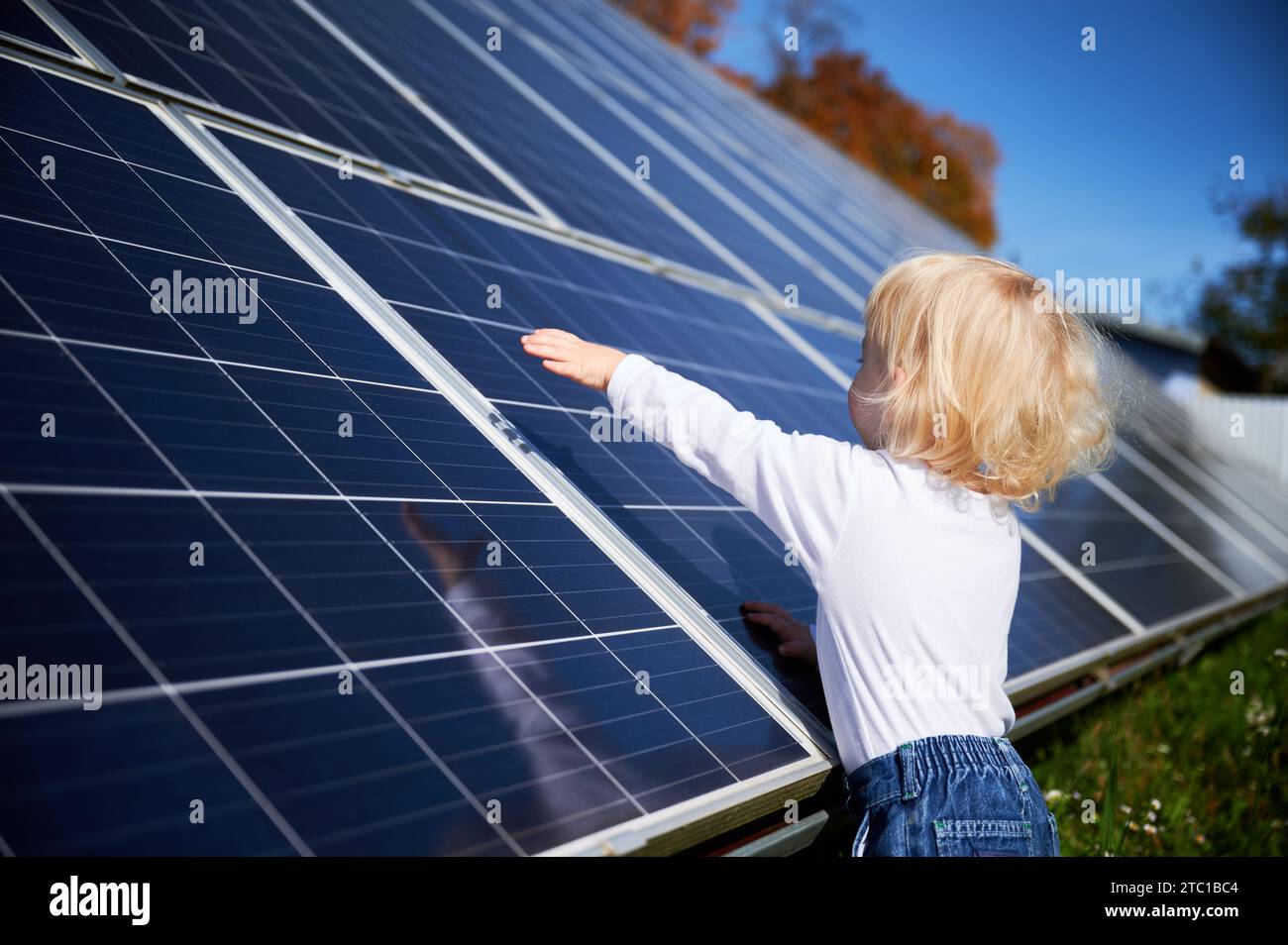 Curious boy interested in how solar panel works. Little child looking ...