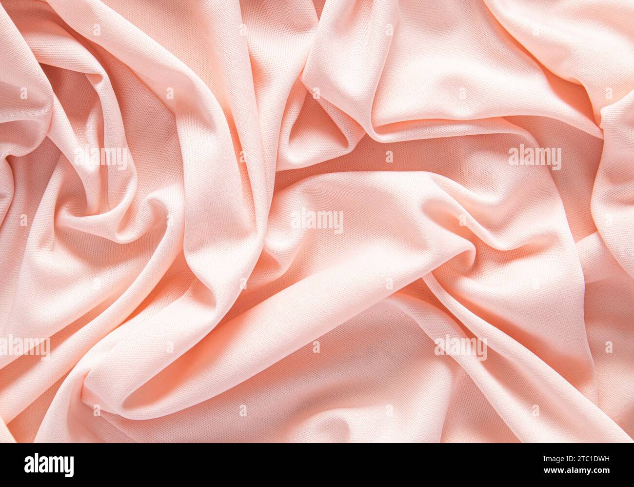 Elegant satin fabric with a peachy color. luxurious texture of the soft ...