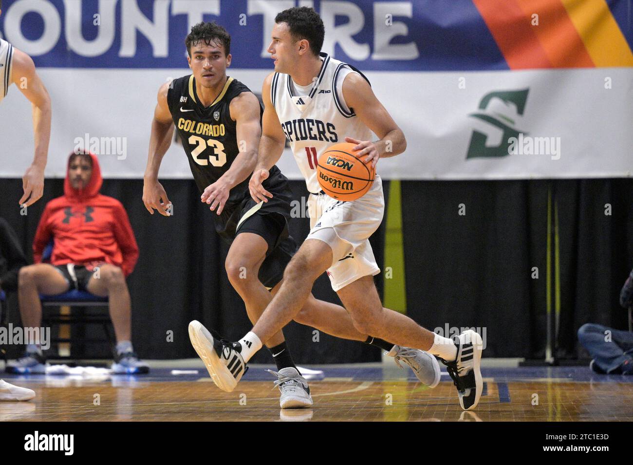 Richmond guard Jason Roche (11) is defended by Colorado forward Tristan ...