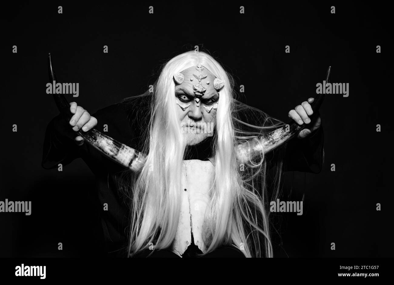 Demon with bloody horns on head. Demon head isolated on black. Man with ...