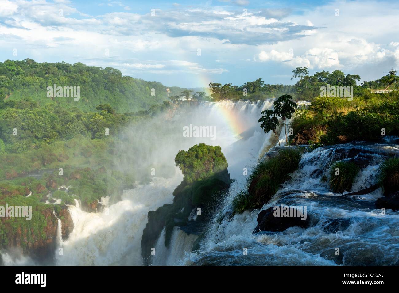 rainbow from water spray. iguazu falls national park from upper trail ...