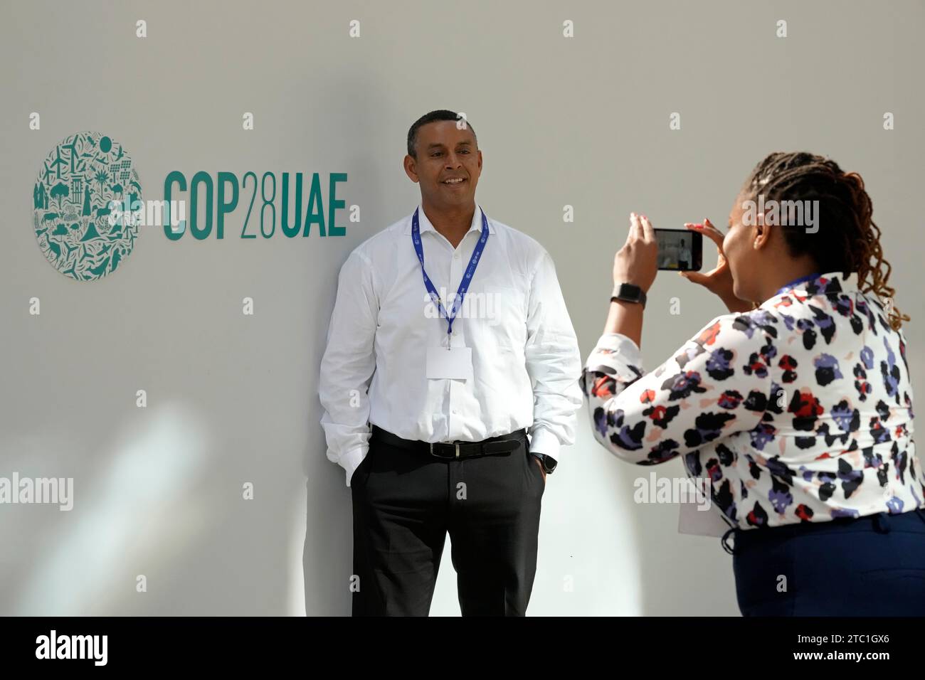 Brittany Carroll takes a photo of Tibebe-Egziabher Abebe at the COP28 U ...