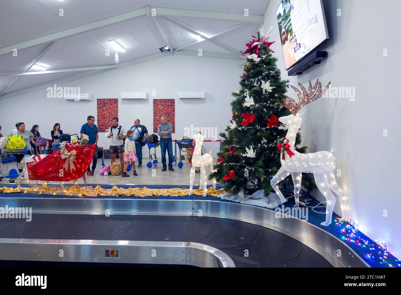Christmas decorations around the luggage carousel at Christmas Island ...