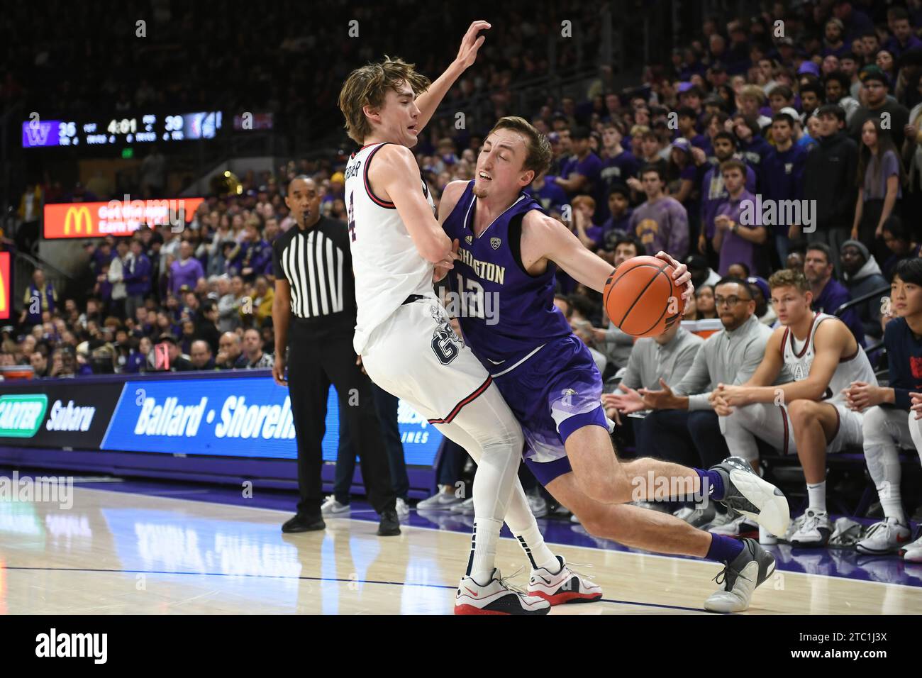 December 09, 2023: Washington Huskies forward Moses Wood (13) draws a ...