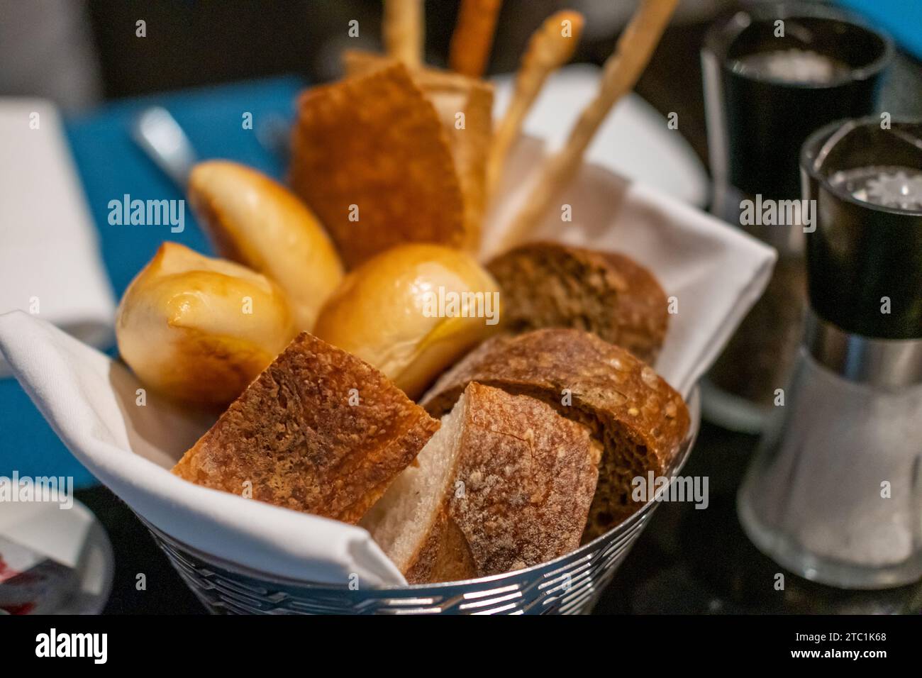 Different types of sliced bread in the basket, on the table in the ...