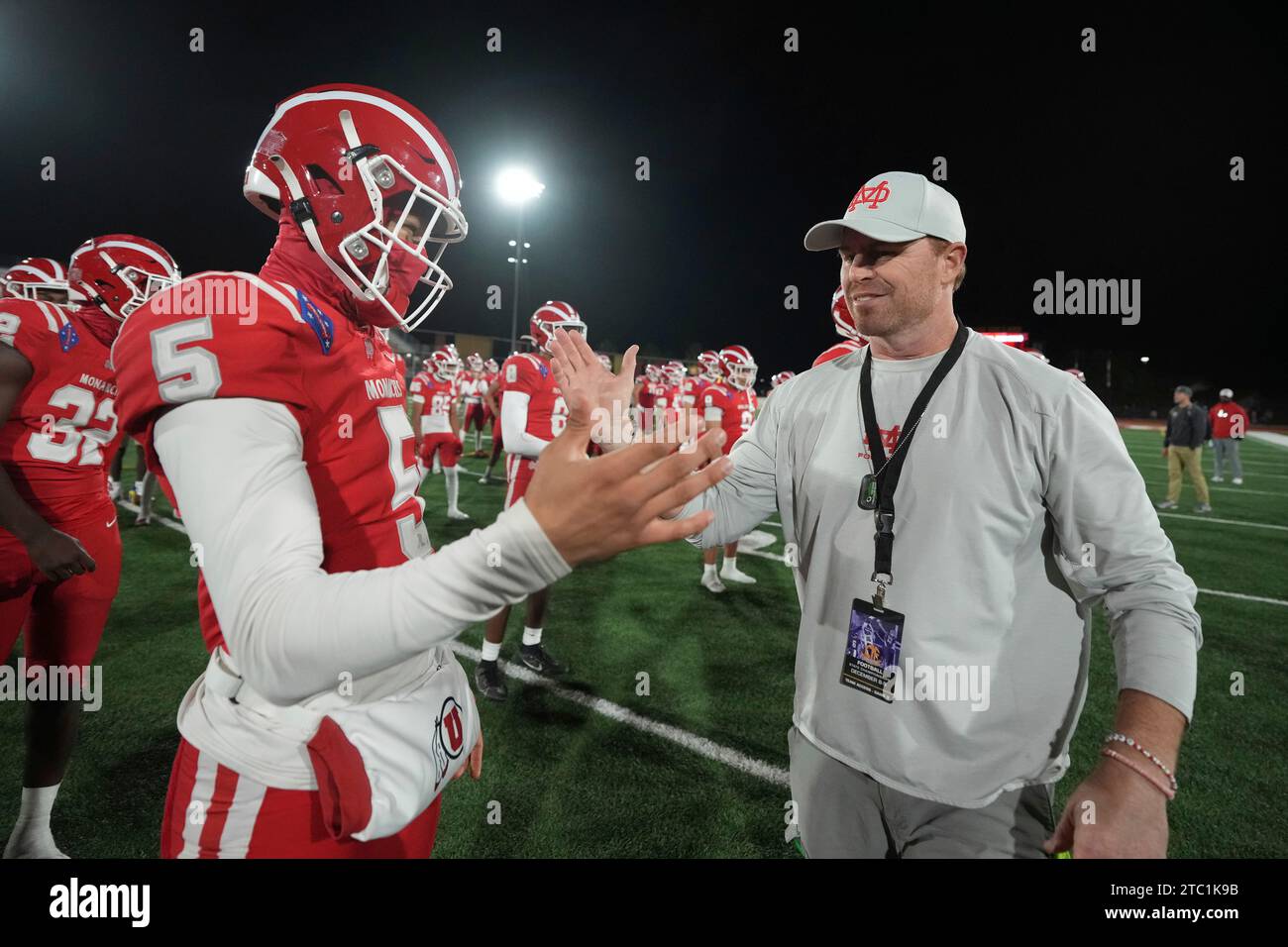 Mater Dei Monarchs coach Frank McManus celebrates with defensive back ...