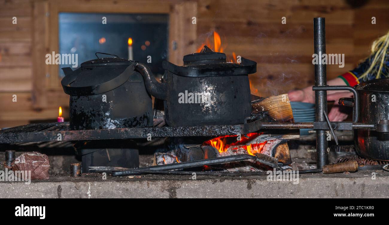 Saariselka, Finland - November 29, 2010: Fireplace in a Sami "kota ...