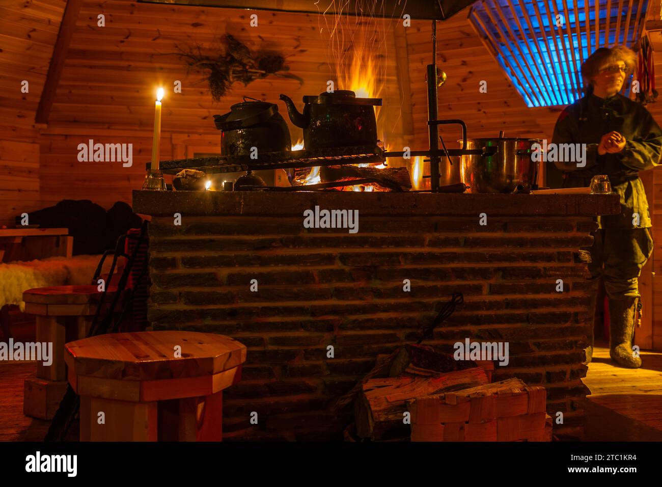 Saariselka, Finland: November 29, 2010: Fireplace in a "kota" with a ...