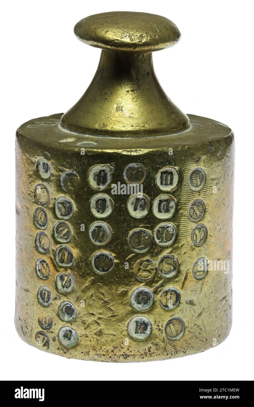 vintage brass weight with several calibration hallmarks isolated on ...