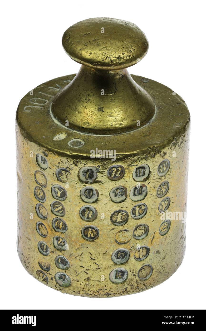 vintage brass weight with several calibration hallmarks isolated on ...