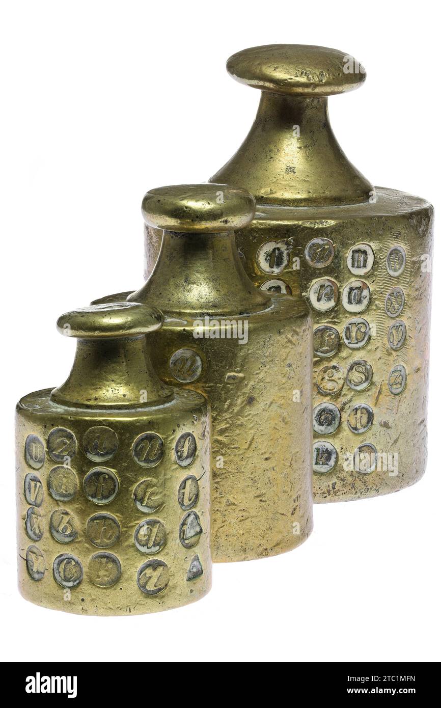 vintage brass weights with several calibration hallmarks isolated on ...