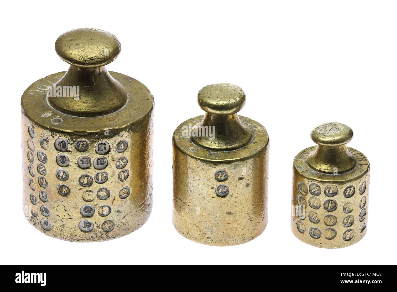 vintage brass weights with several calibration hallmarks isolated on ...