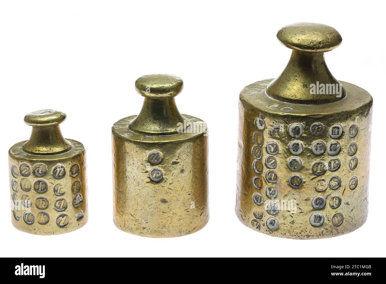 vintage brass weights with several calibration hallmarks isolated on ...