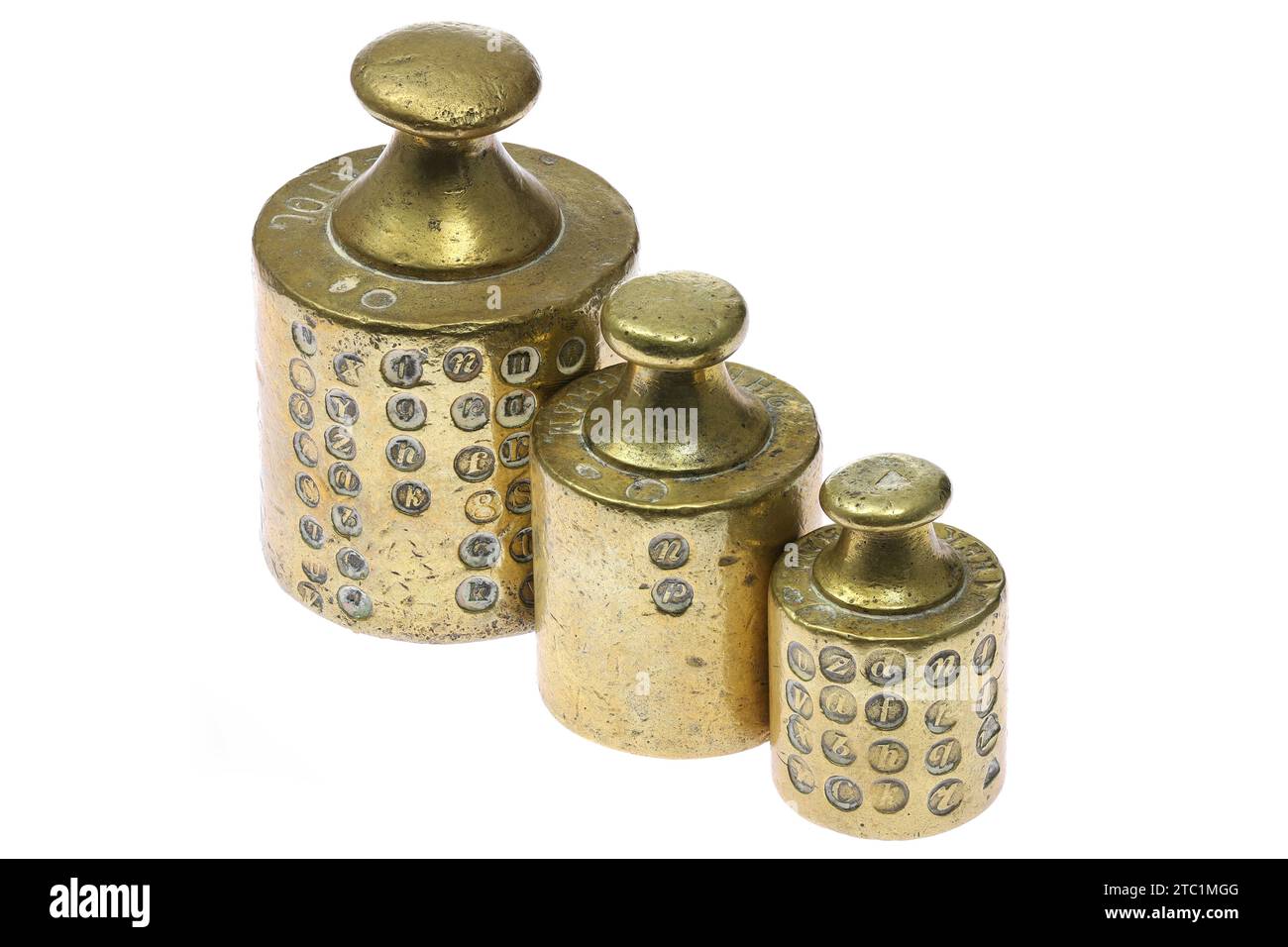 vintage brass weights with several calibration hallmarks isolated on ...