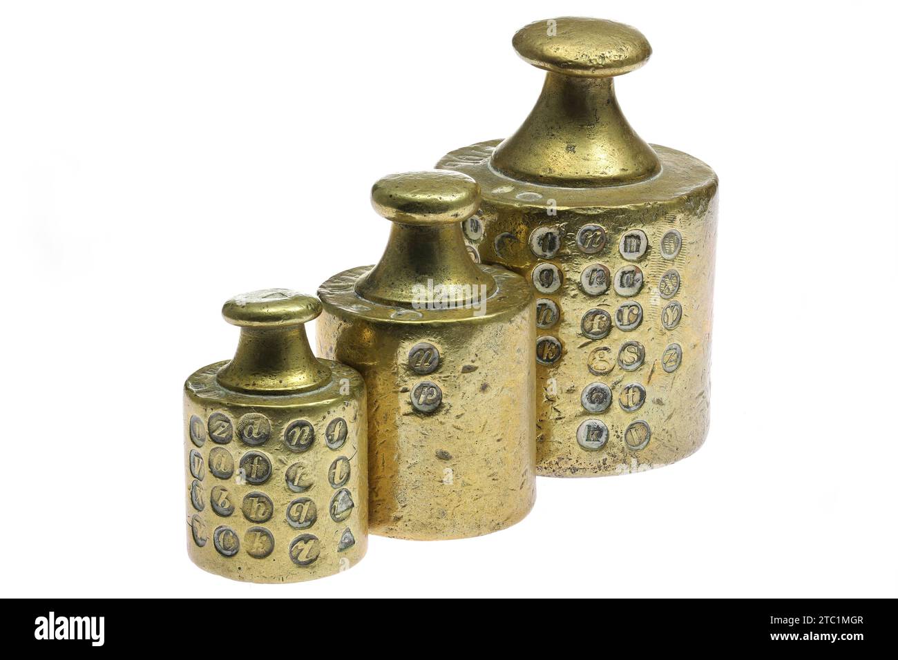vintage brass weights with several calibration hallmarks isolated on ...