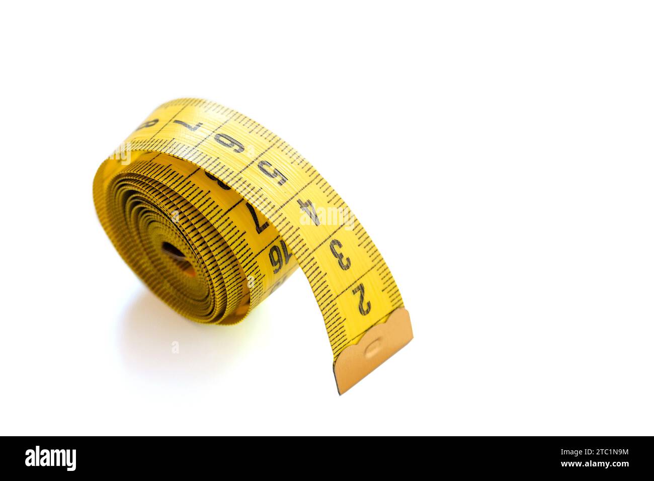 Yellow measuring tape isolated on white background. Close-up. Side view ...