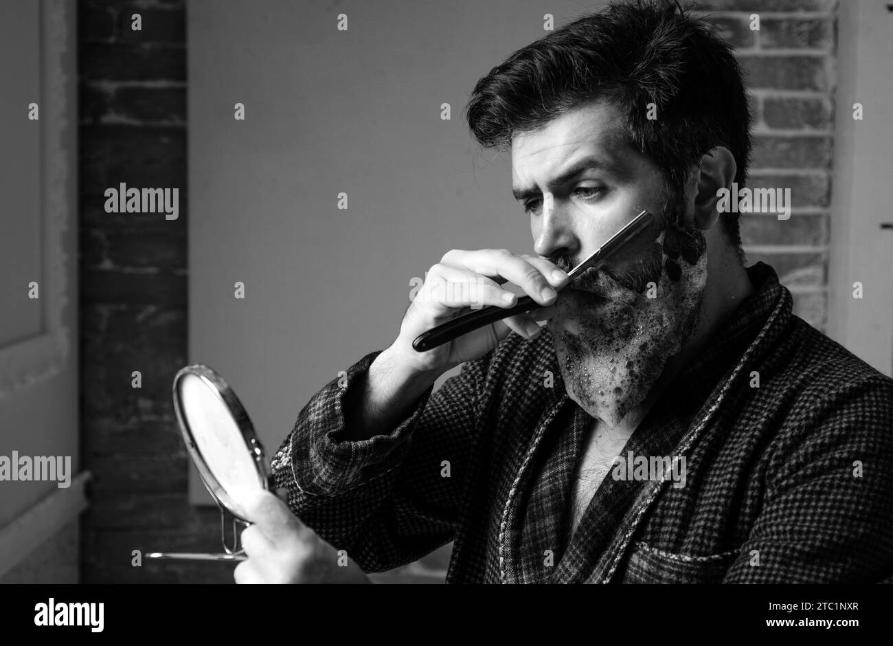 Barbershop concept. Hairdresser makes hairstyle a man with a beard ...