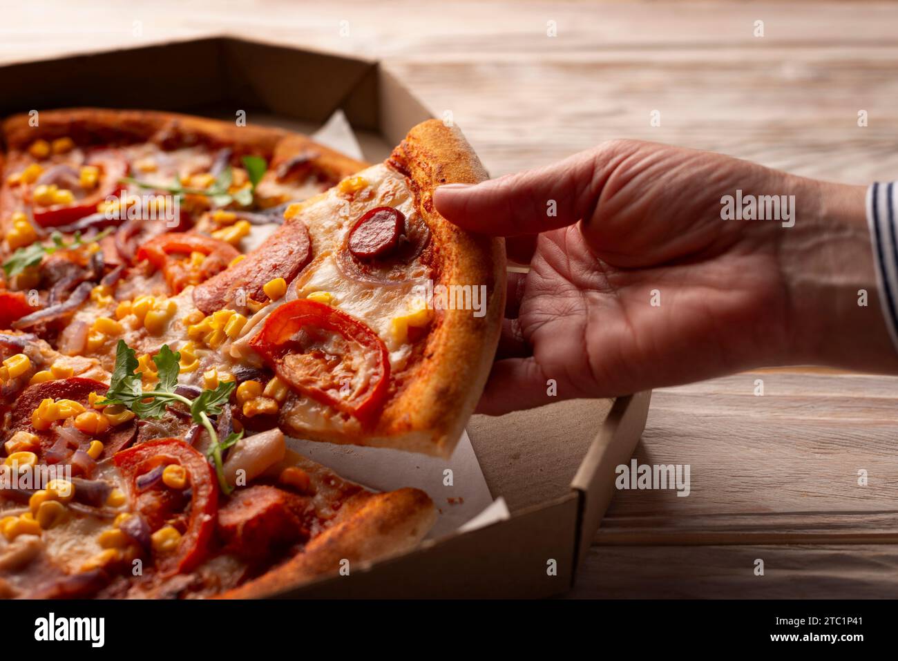 Pizza slice hand hi-res stock photography and images - Alamy