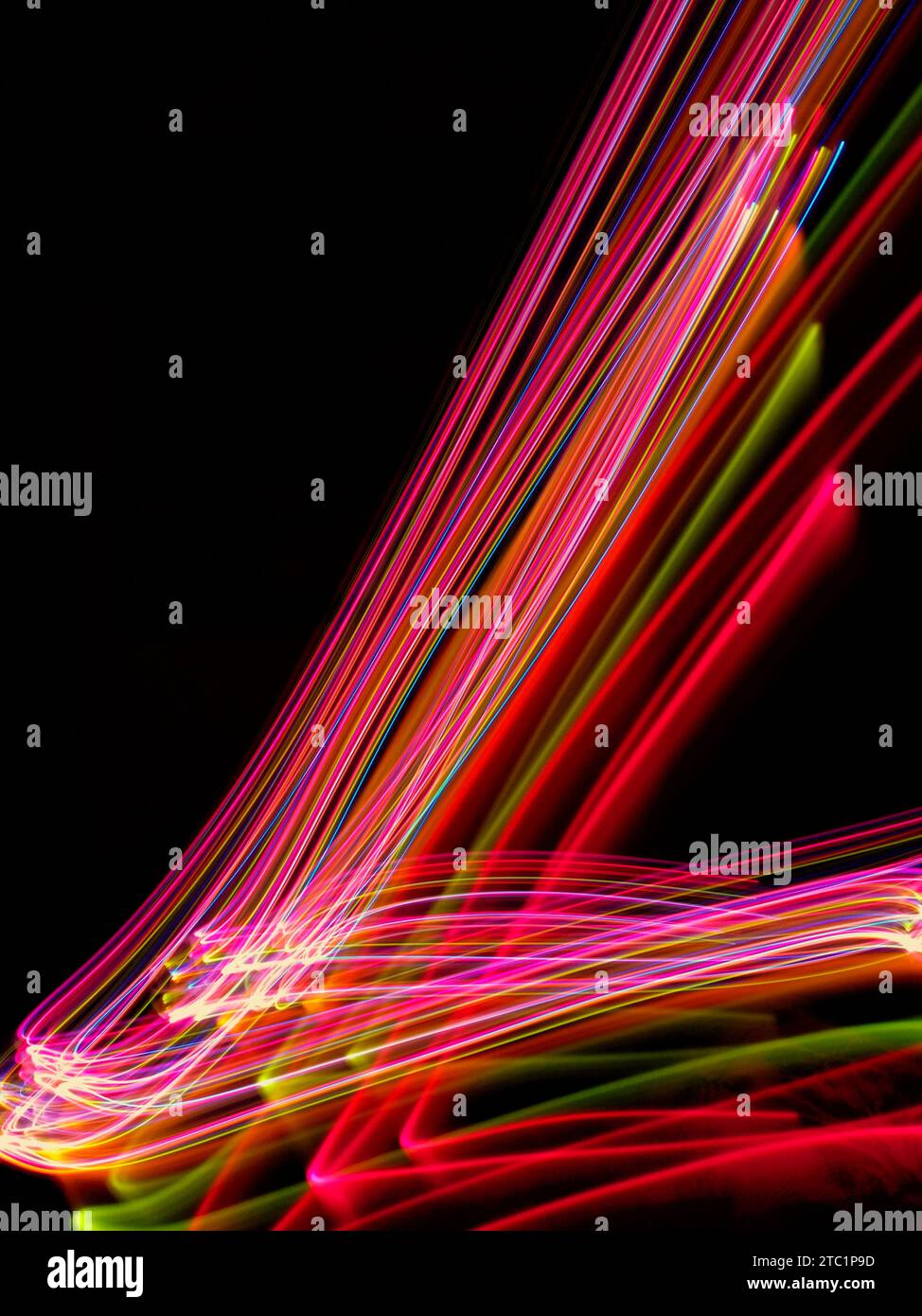 Long exposure light trails of pink, orange, yellow and blue light Stock ...