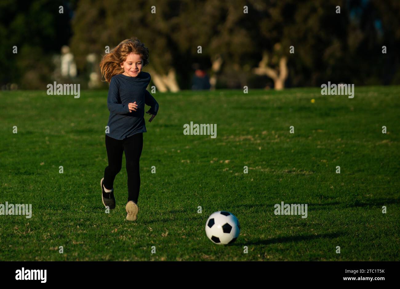 Soccer kid boy playing football. Child boy play football on outdoor ...