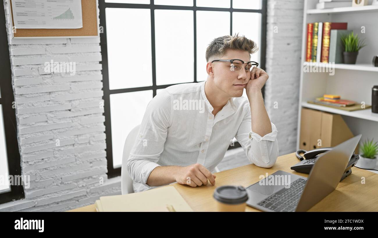 Focused young caucasian businessman thinking hard at office desk, his ...