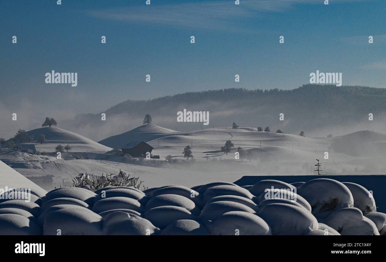 An expansive landscape of untouched snow is seen in the foreground ...
