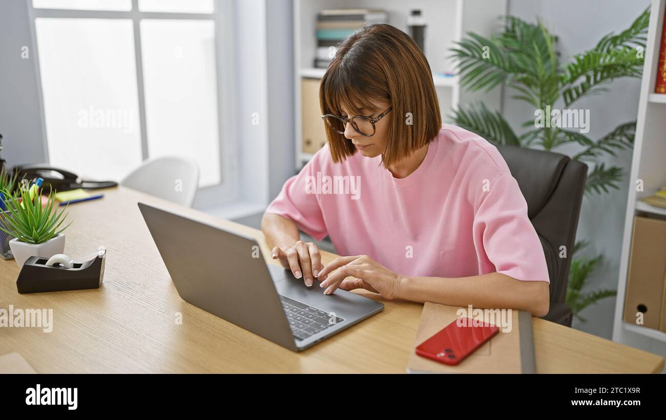 Young, beautiful, serious hispanic woman boss, a successful business ...