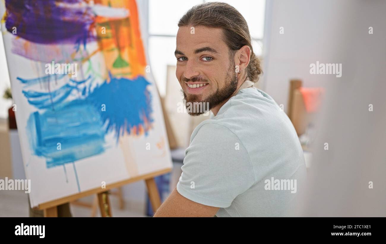 Young hispanic man artist smiling confident drawing at art studio Stock ...