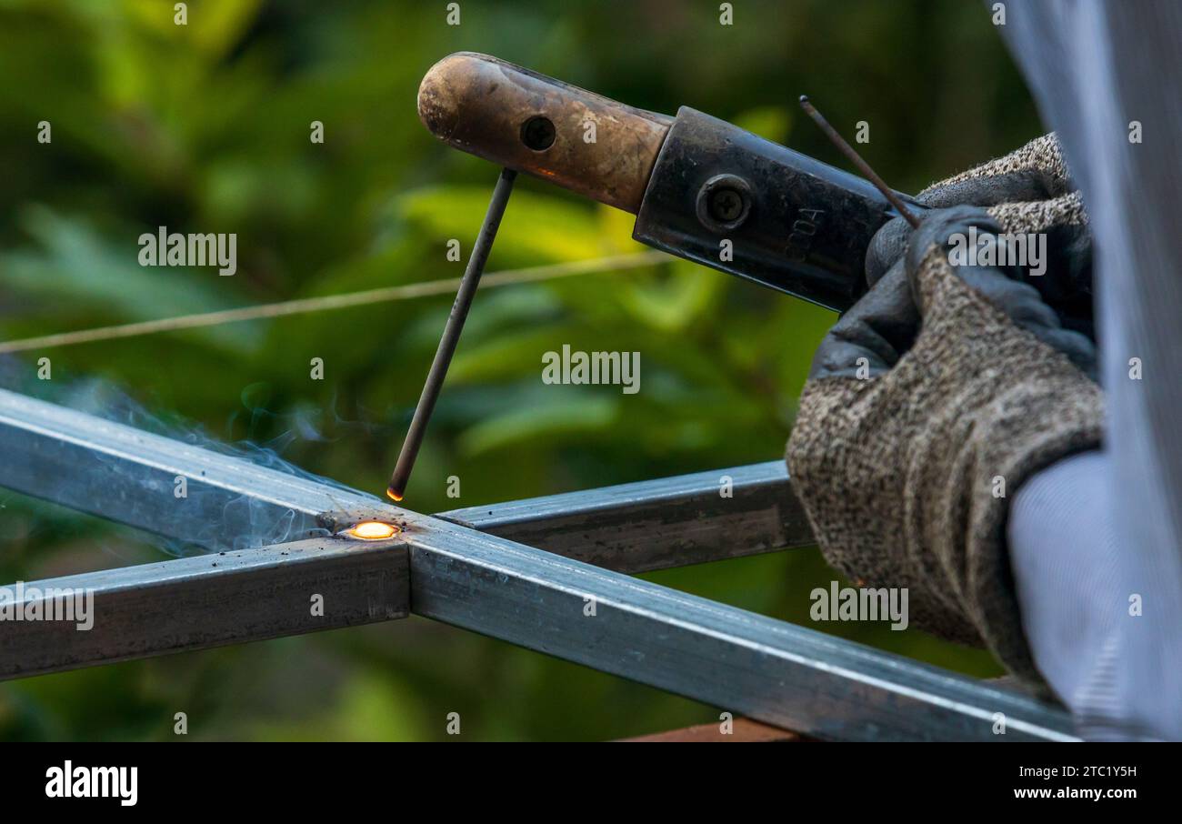 Red hot Welding bead, seam made by SMAW while welding due to liquify of ...