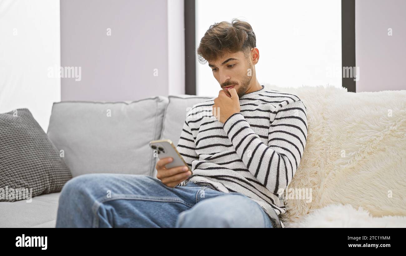 Serious young arab man doubting his next idea, deeply immersed while ...