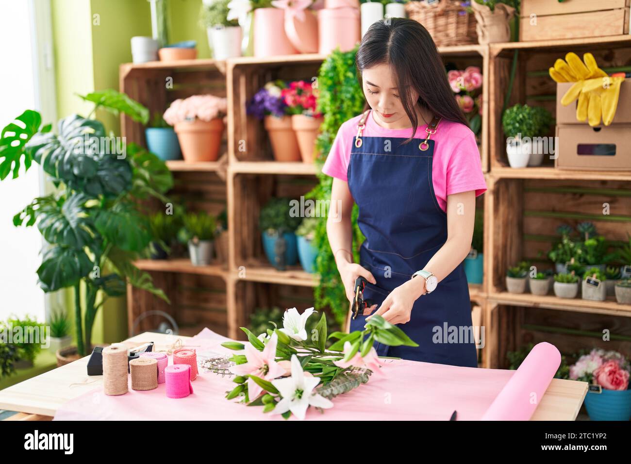 Serious young asian florist hi-res stock photography and images - Alamy