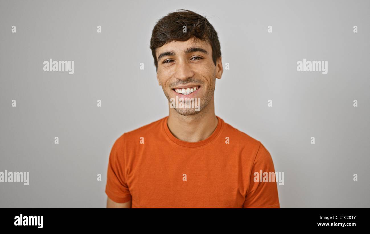 Cheerful young hispanic guy confidently standing, flaunting his ...