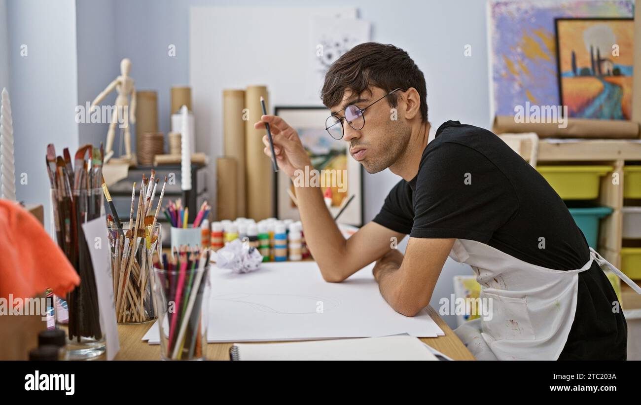 Captivating glimpse into a young hispanic man's world, artist, brush in ...