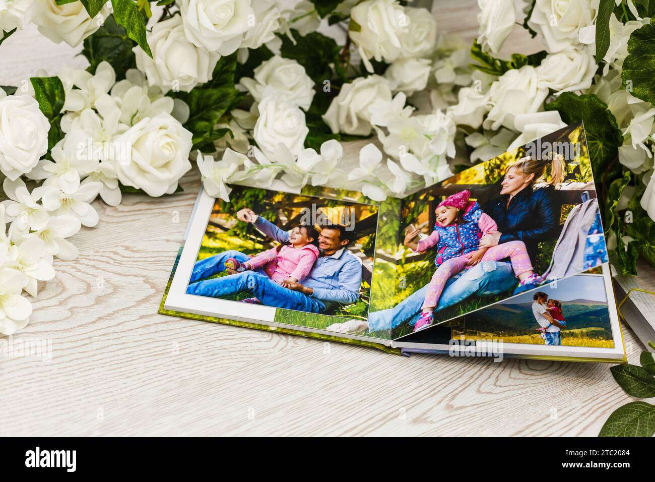 Family photos archive saved in brightly designed photo book; bright ...