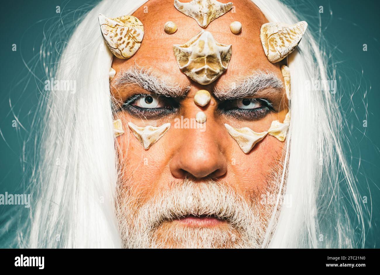 Burning diabolic demon summons evil forces and opens hell. Elderly man ...