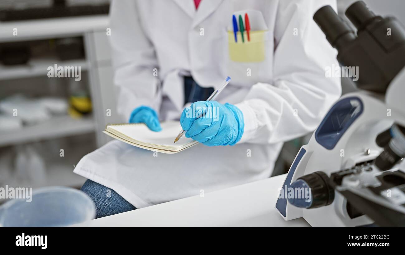 Woman laboratory worker taking notes hi-res stock photography and ...