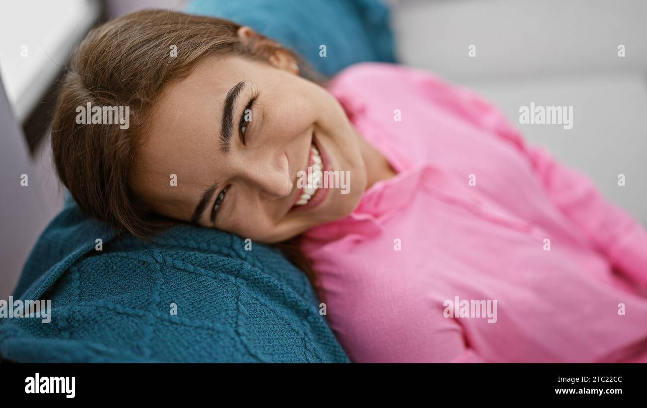 Radiant young hispanic woman shows joy, confidence, relaxation while ...