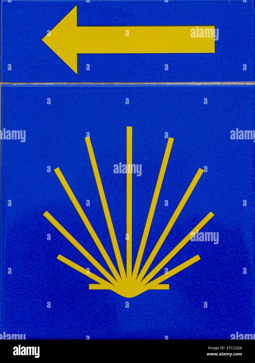 blue direction symbol with arrow to the left side of the Camino de ...