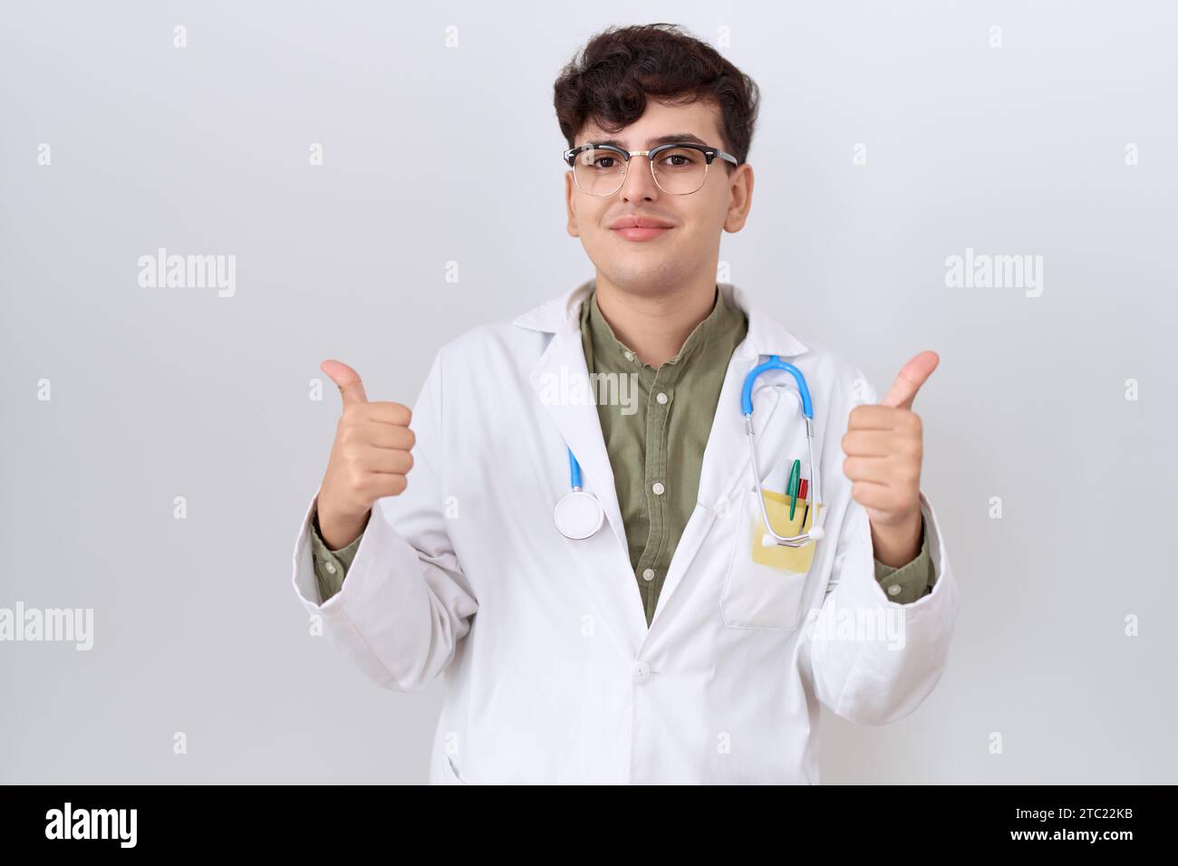 Young non binary man wearing doctor uniform and stethoscope success ...