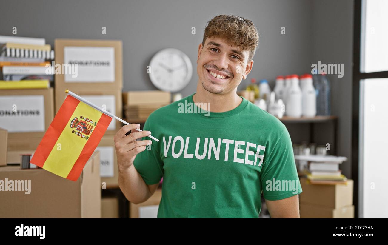 Portrait of a handsome, smiling young hispanic volunteer brimming with ...