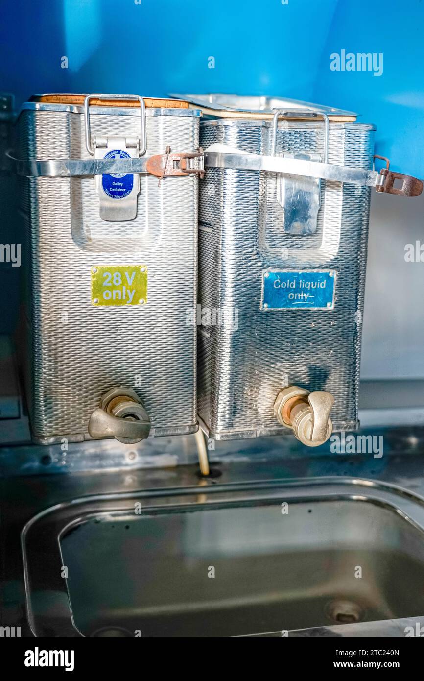 vats of liquids for consumption used by passengers on the Dakota DC-3l ...