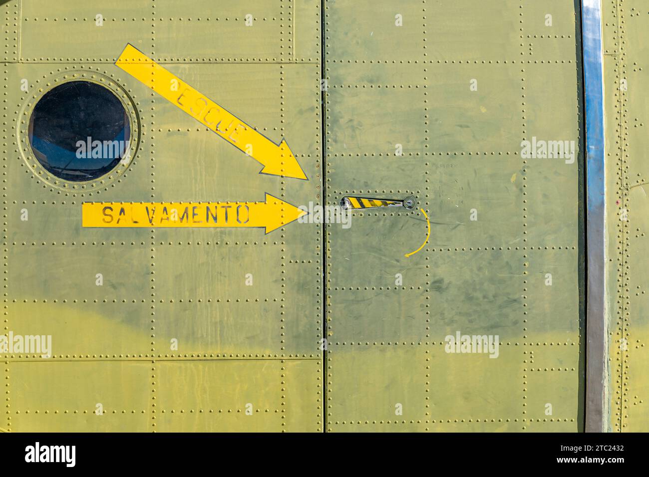 yellow arrows on airplane fuselage indicating rescue door handle Stock ...