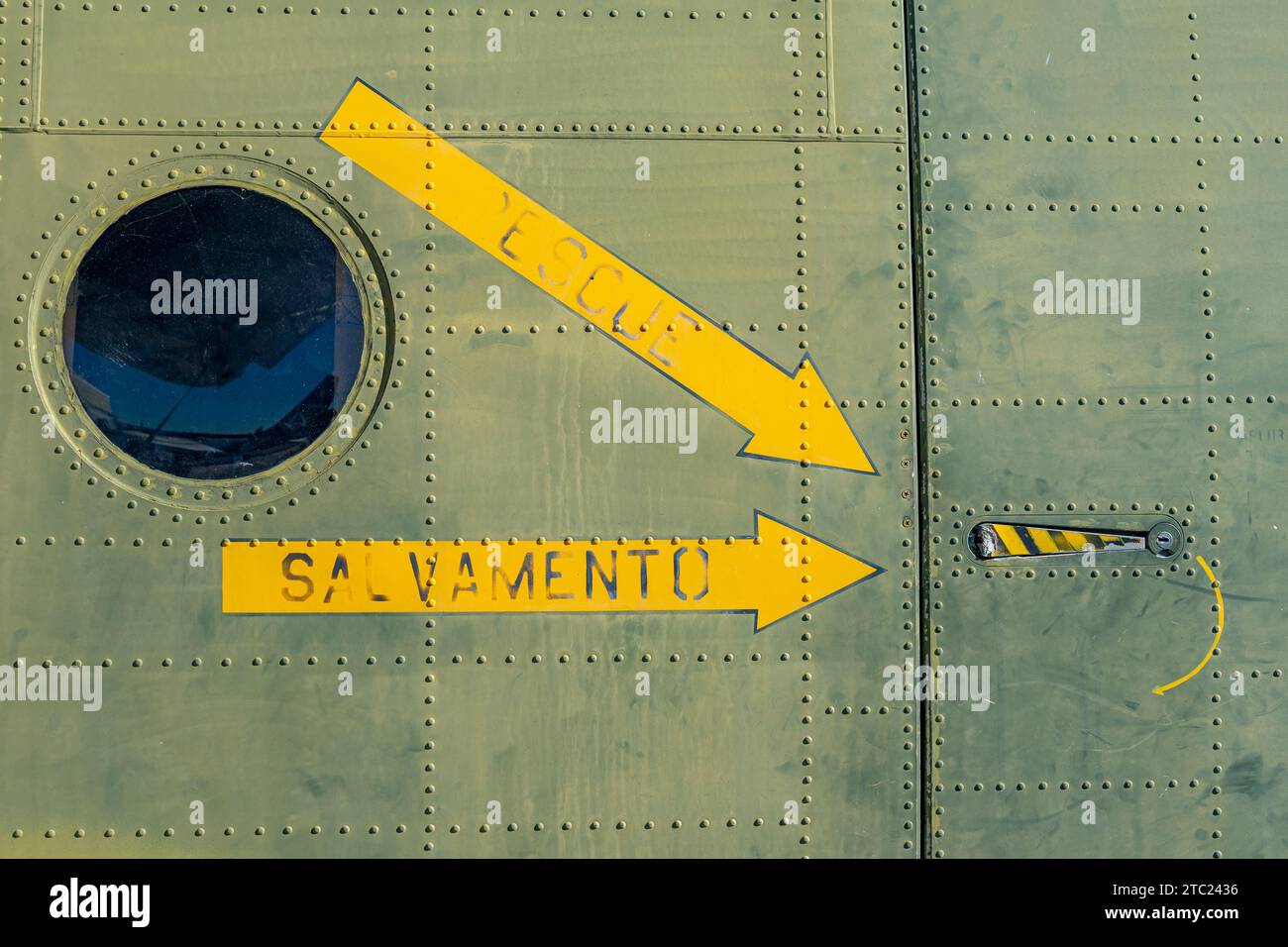 yellow arrows on airplane fuselage indicating rescue door handle Stock ...
