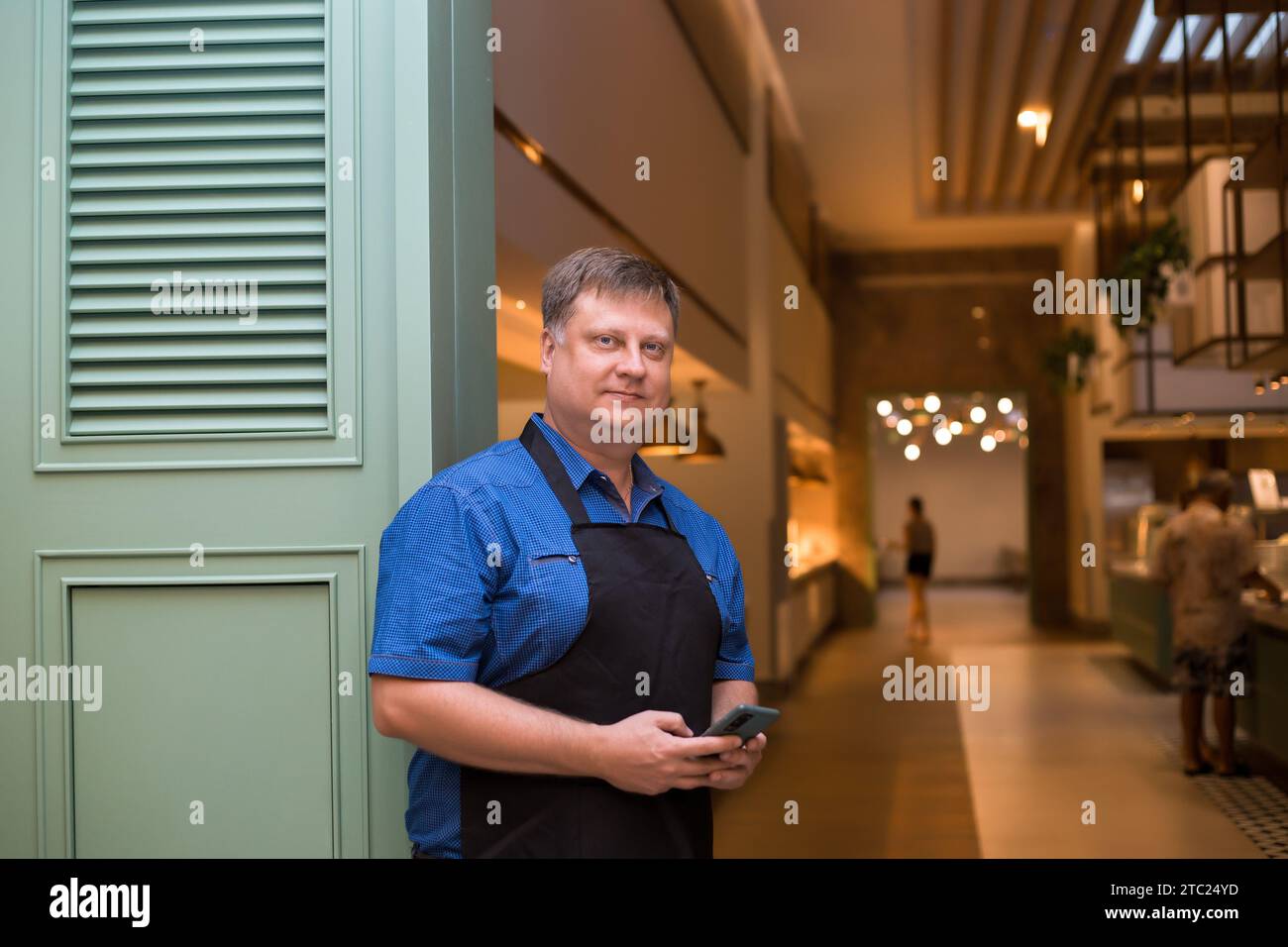 Cafe owner standing in entrance hi-res stock photography and images - Alamy