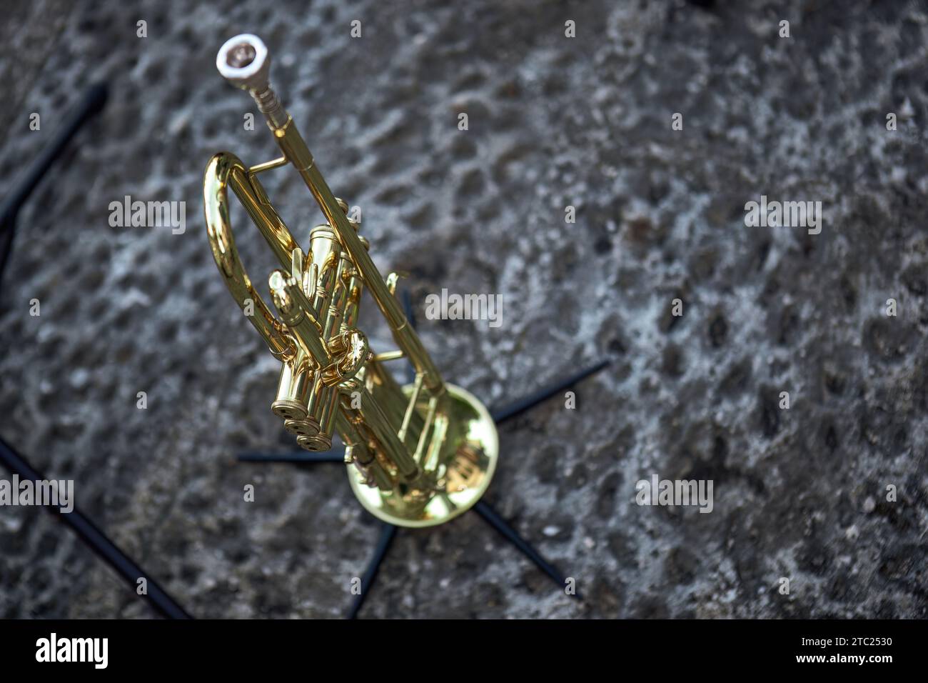 A detailed view of a trumpet set up and waiting, poised for a live ...
