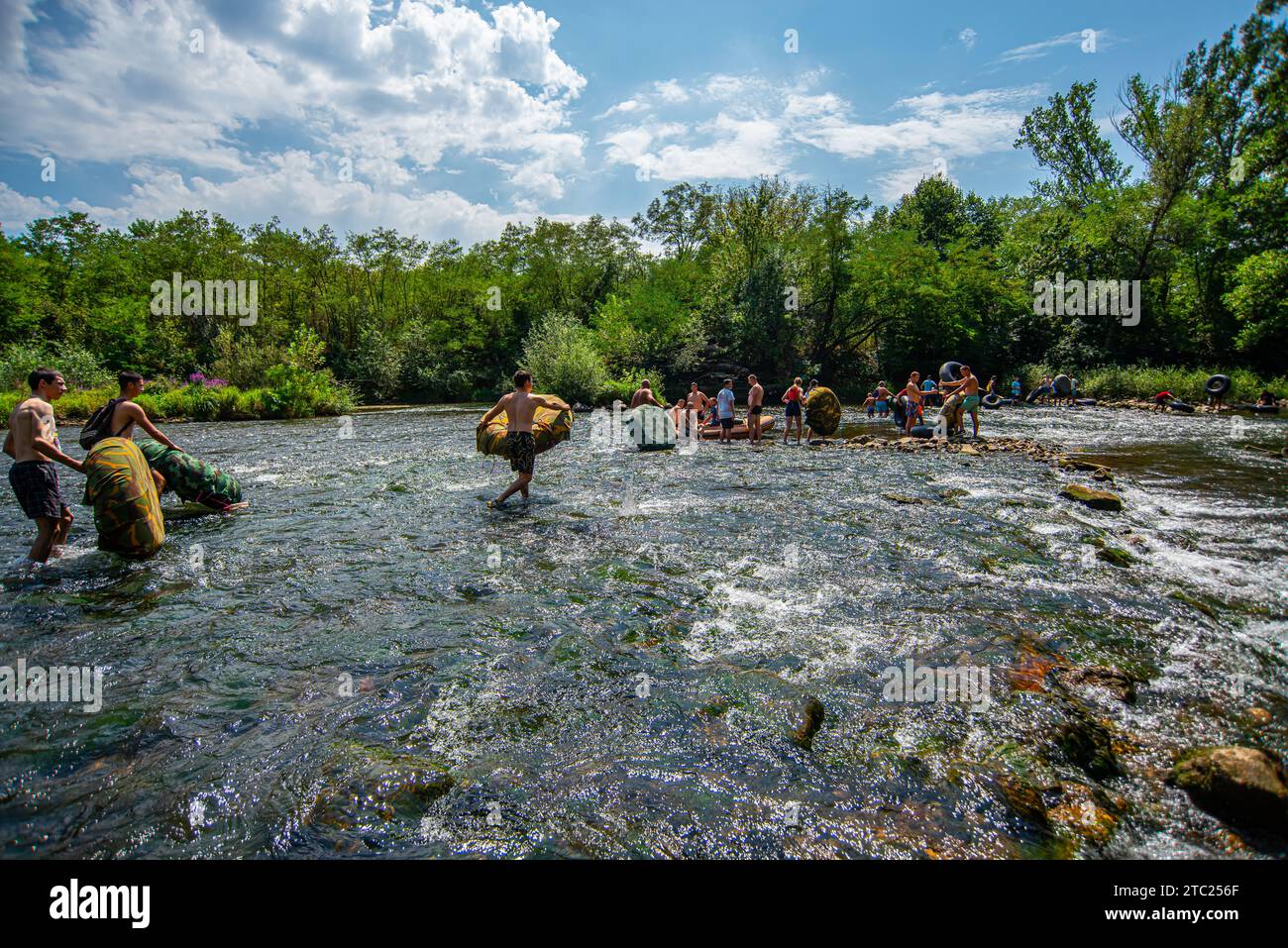 20 August 2023 Nisava river, Serbia, Group of young people enjoy river ...