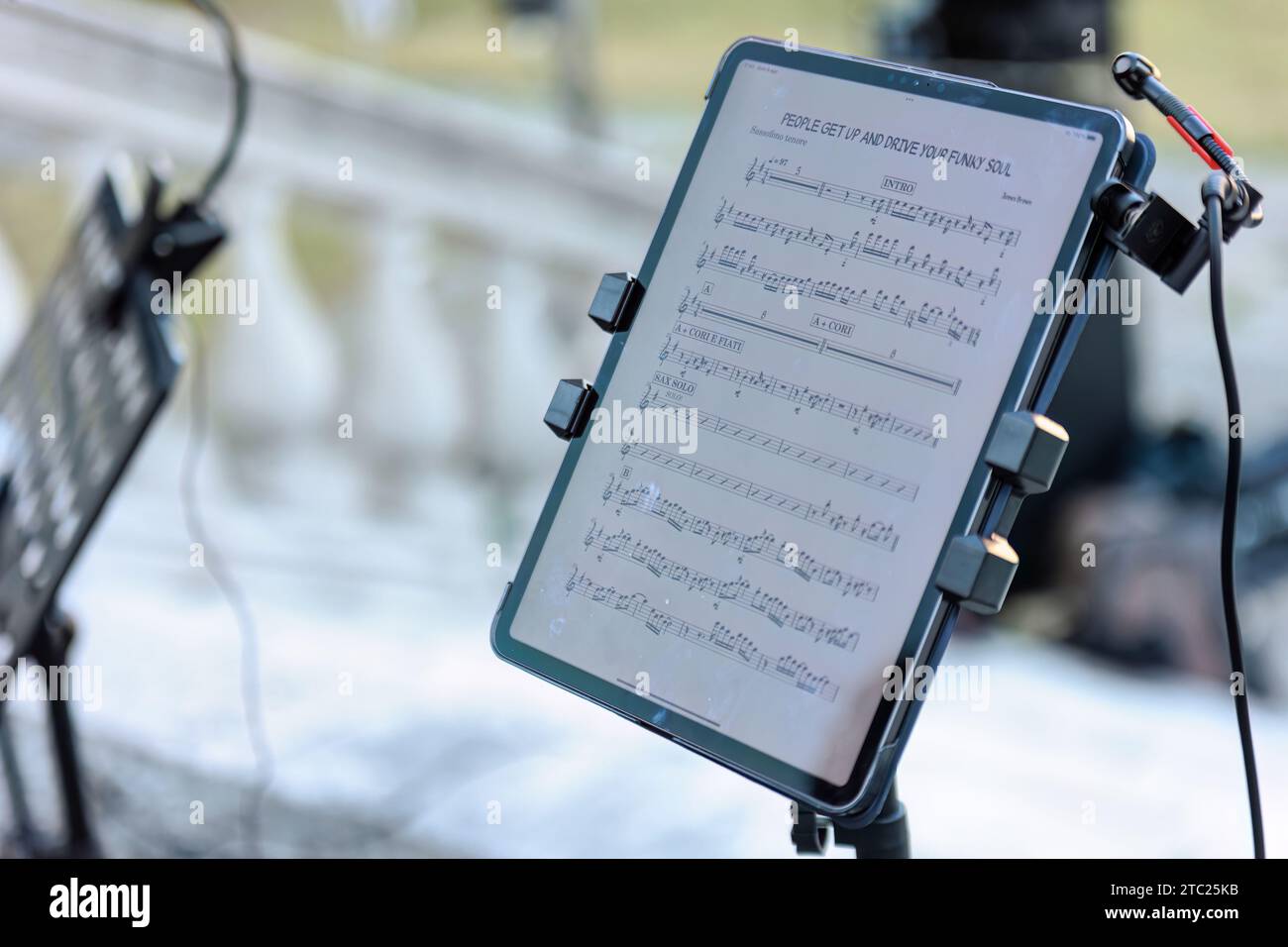 A tablet displaying a musical score, ready for a live concert ...