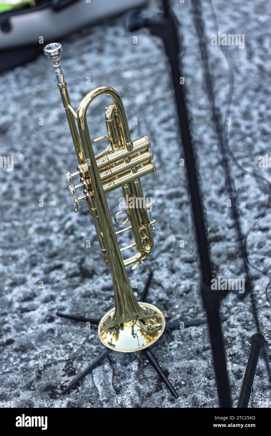 A detailed view of a trumpet set up and waiting, poised for a live ...